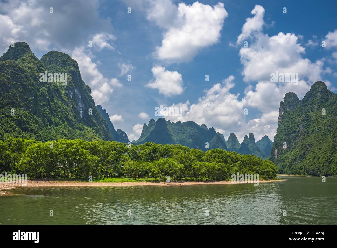 Panoramic view of the stunning karst mountain scenery on the riverbank ...