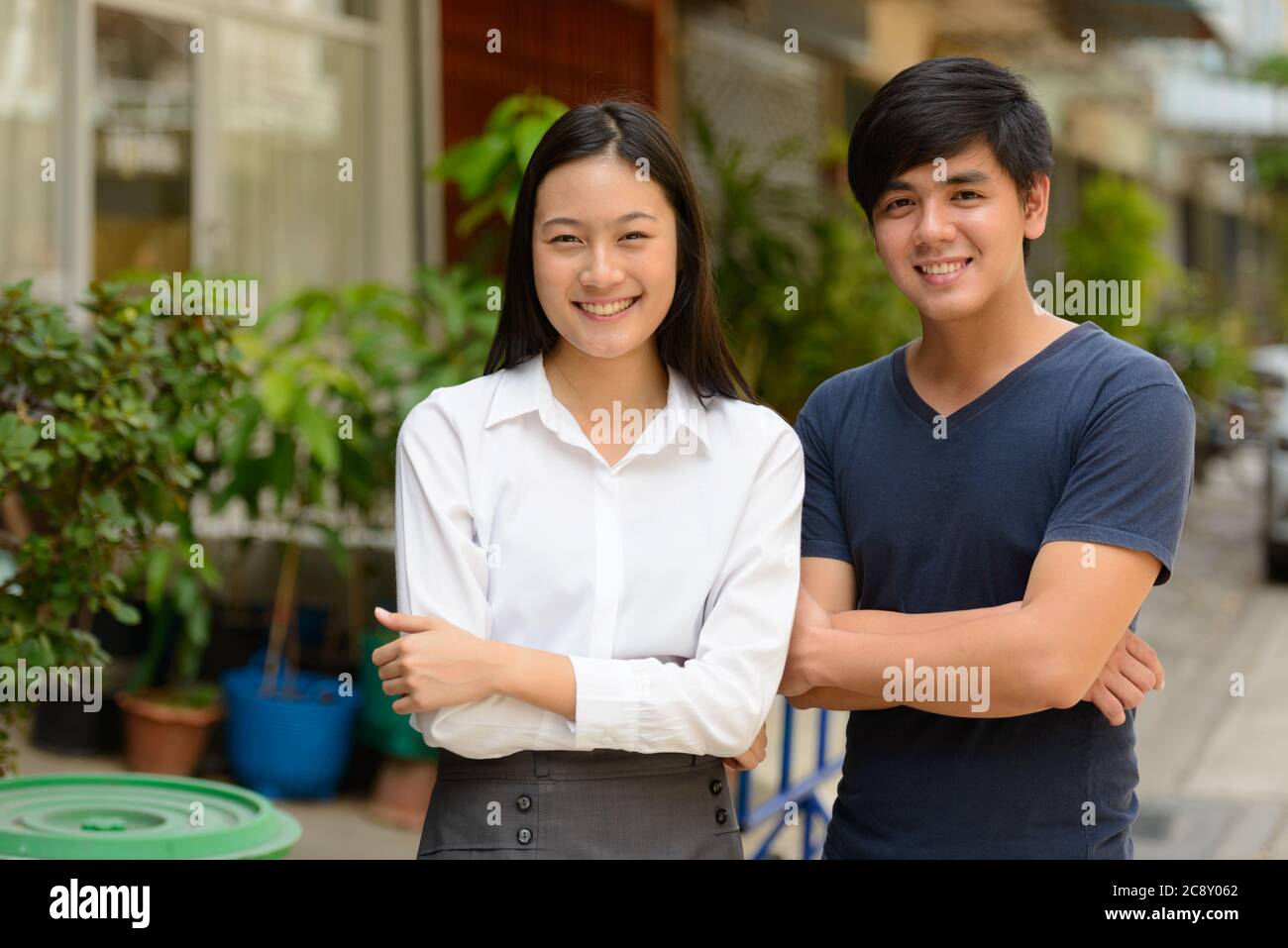Portrait of young Asian couple together outdoors Stock Photo - Alamy