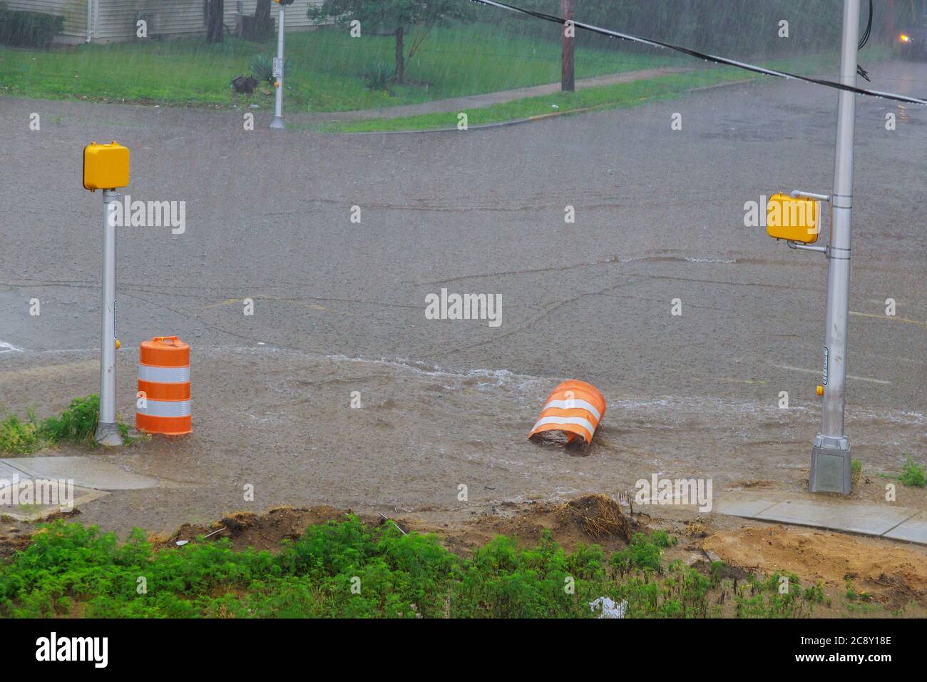 Residential on city street during downpour street floodedheavy rain ...