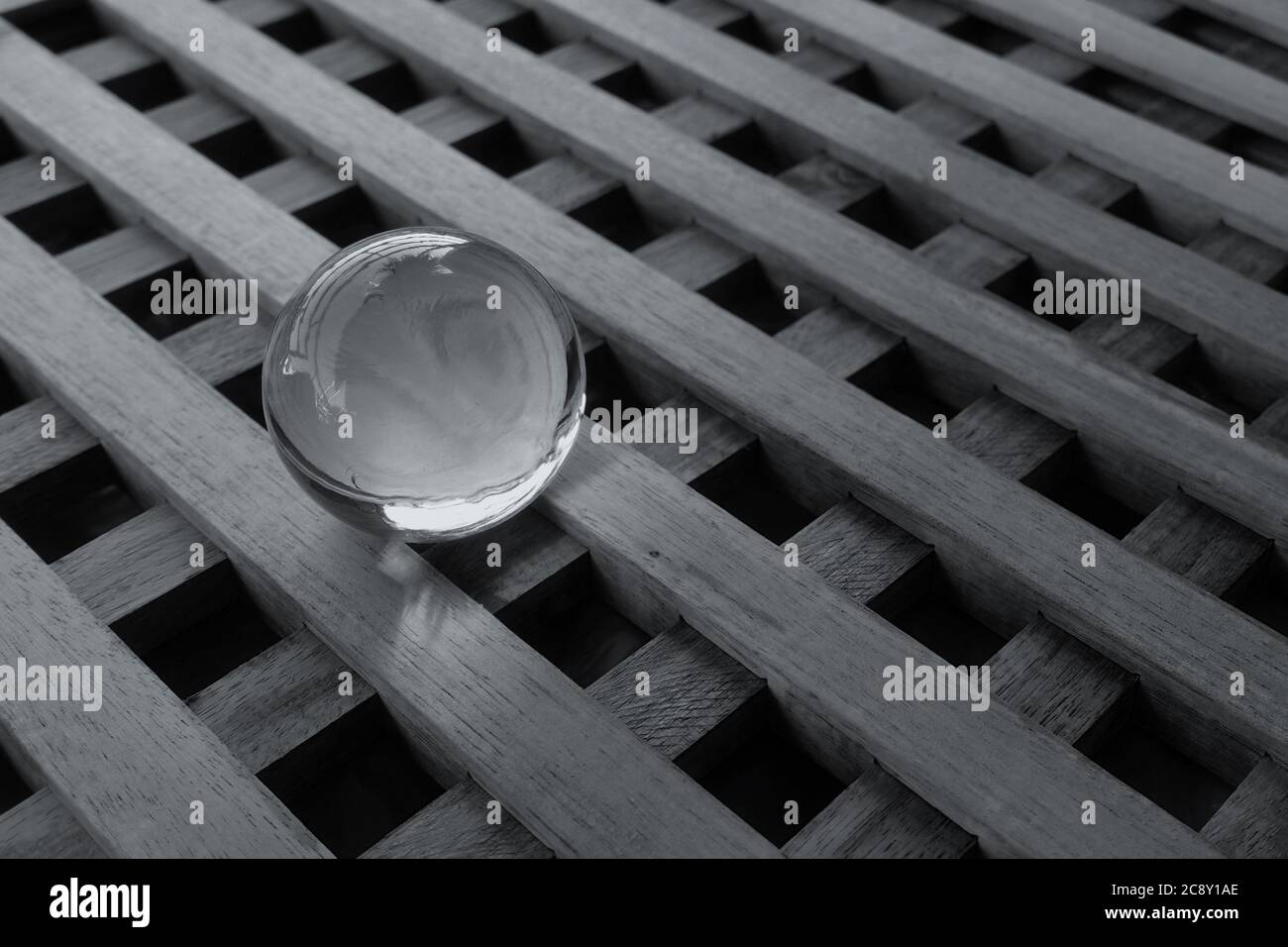 Glass sphere and wooden squares checkered pattern. Abstract geometric ...