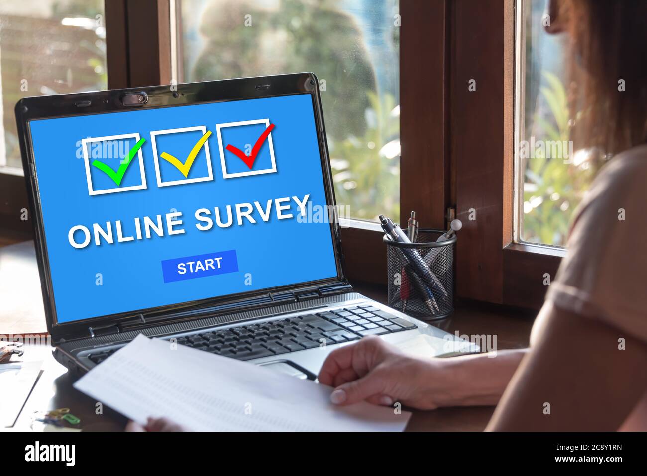 Laptop screen displaying an online survey concept Stock Photo - Alamy