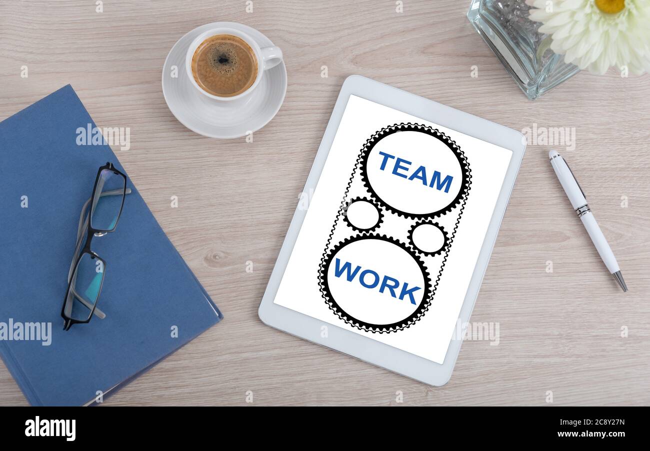 Top view of a desk with teamwork concept on a digital tablet Stock ...