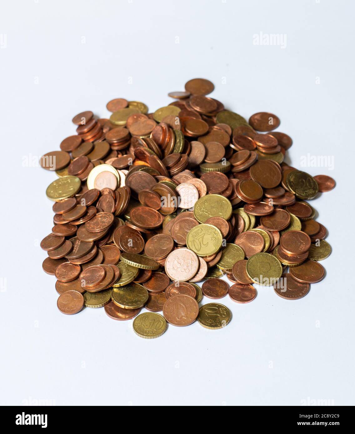 a pile of loose change. used european coins on white background. Euro ...