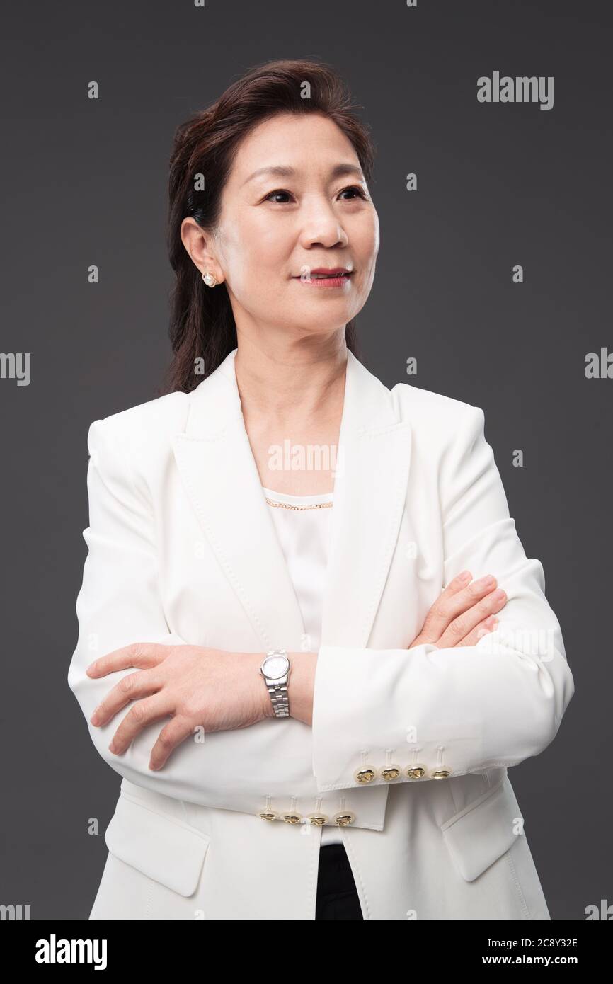 Ms arms crossed the authority of the business Stock Photo - Alamy