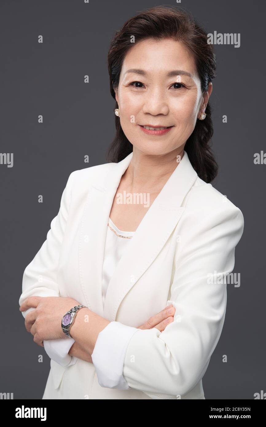 Ms arms crossed the authority of the business Stock Photo - Alamy