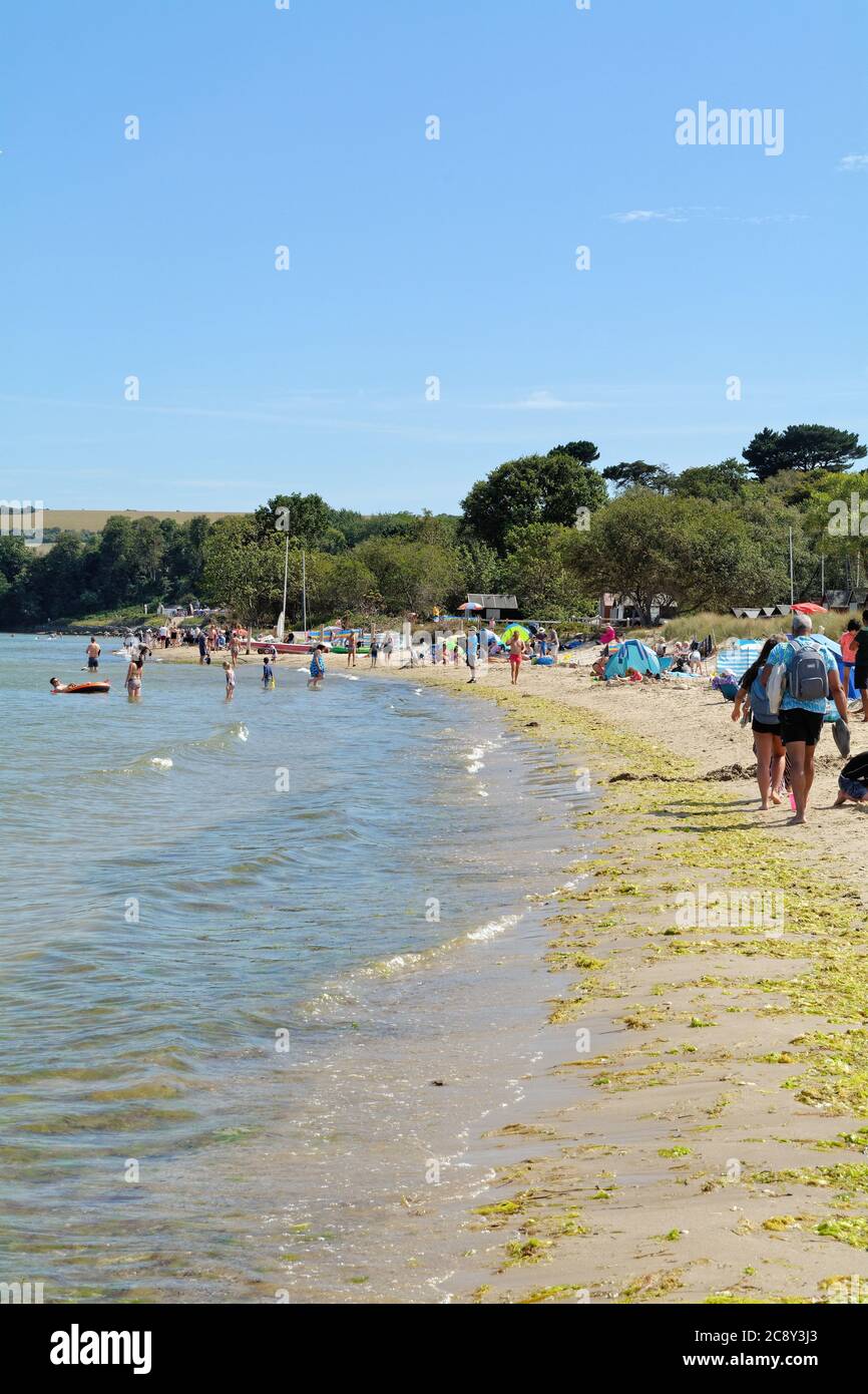 A crowded Knoll beach at Studland Bay on a hot sunny summers day ...
