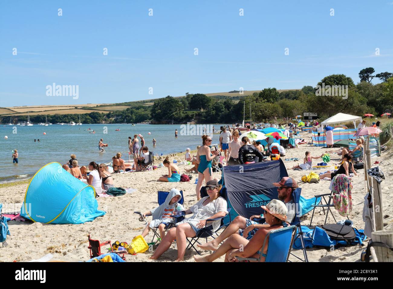 A crowded Knoll beach at Studland Bay on a hot sunny summers day ...