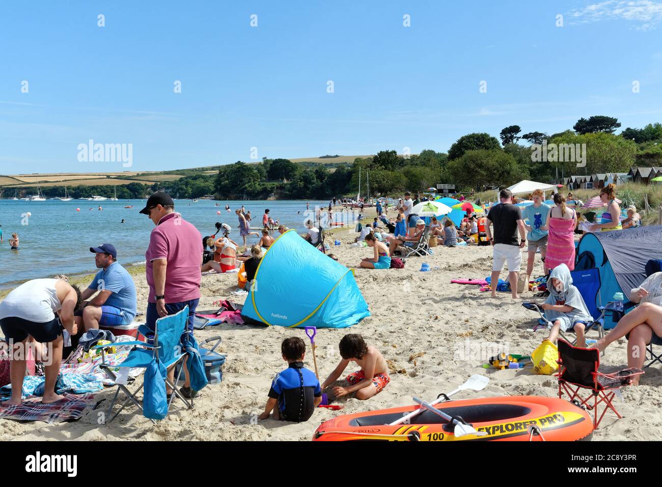 A crowded Knoll beach at Studland Bay on a hot sunny summers day ...