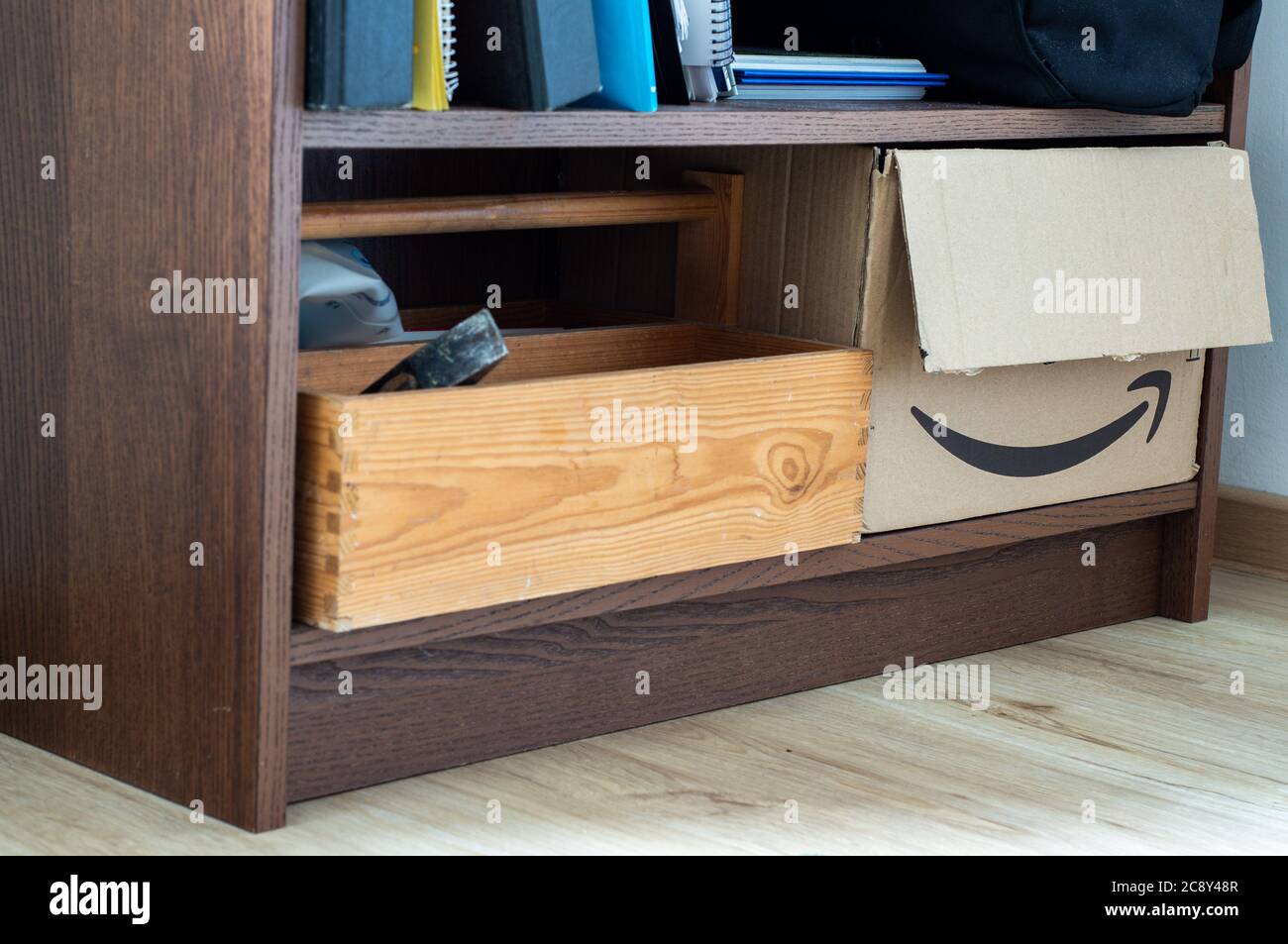 reuse of old packages cardboard as a box in a shelf. Upcycling Stock ...