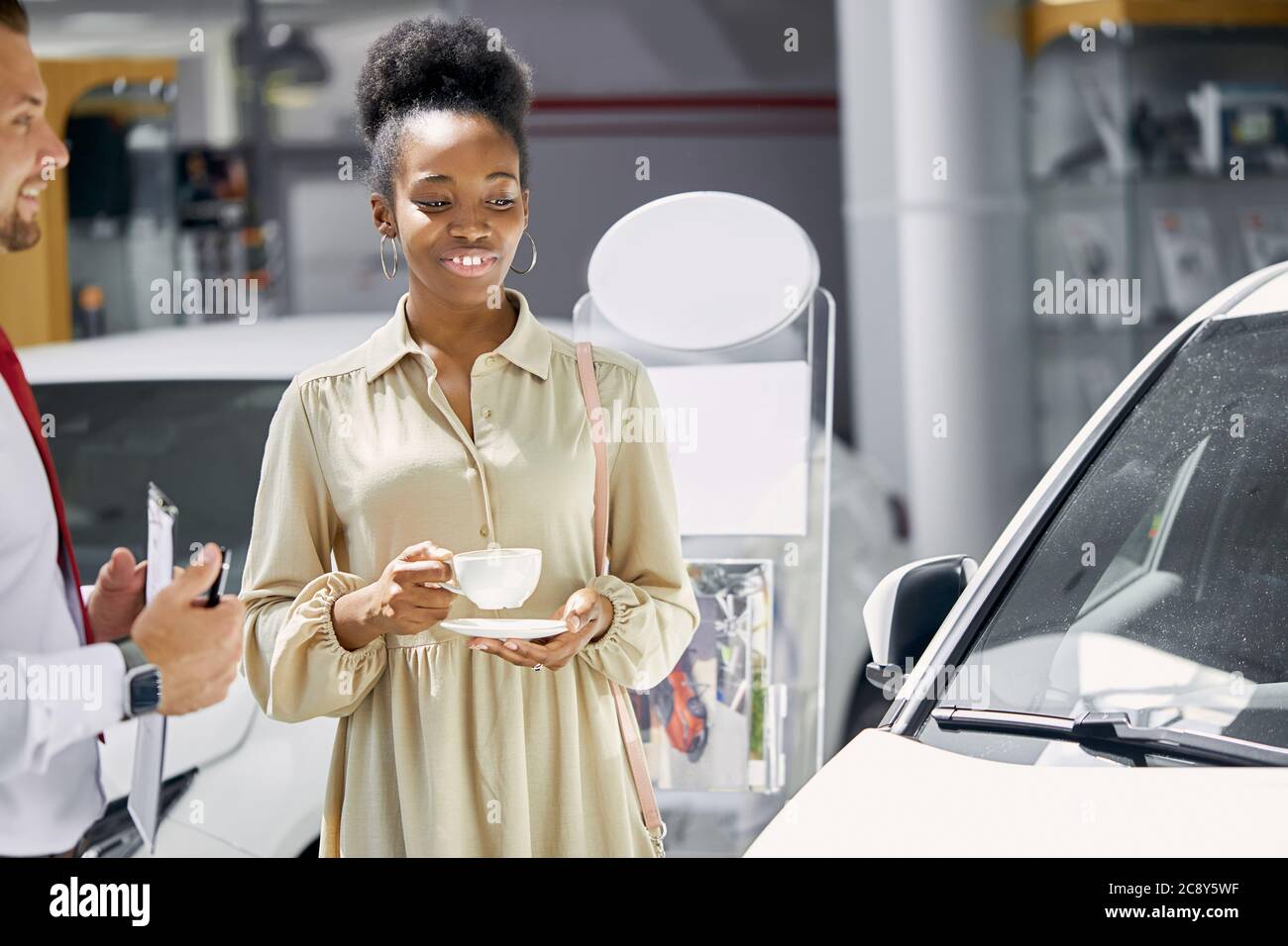 young attractive afro woman enjoy being owner of new auto, business ...
