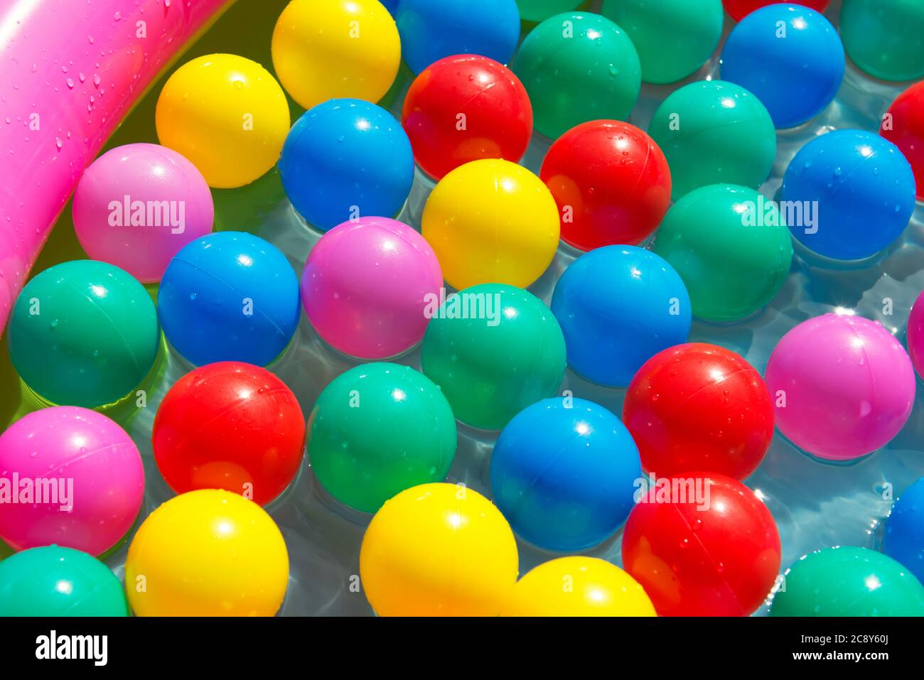Colorful balls in the swimming pool, summer concept Stock Photo - Alamy