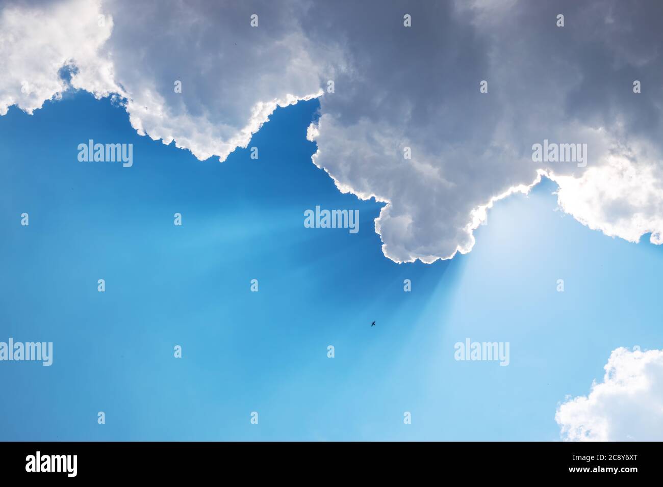 Sun, sunbeam and clouds in blue sky Stock Photo - Alamy