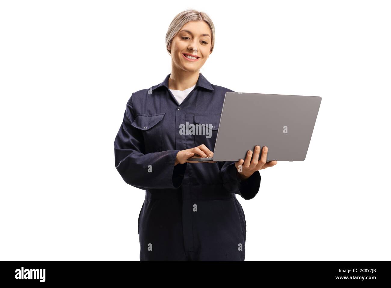 Female worker in a uniform holding a laptop computer isolated on white ...