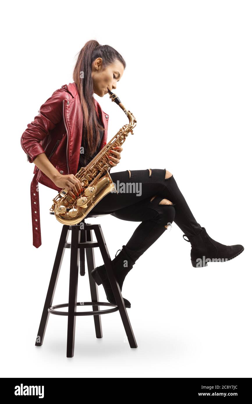 Full length profile shot of a female musician sitting on a chair and ...