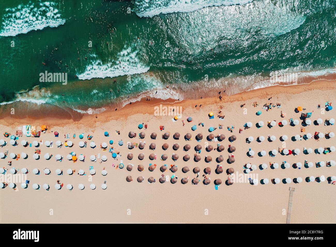 Aerial top view on the beach. Umbrellas, sand and sea waves Stock Photo ...