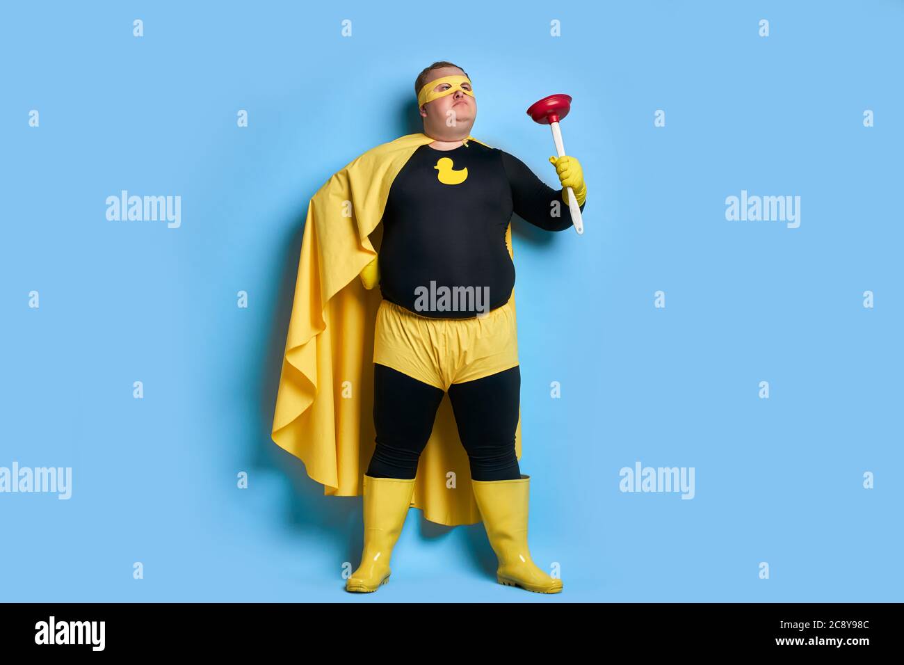 portrait of cleaning superhero with plunger, man ready to solve ...