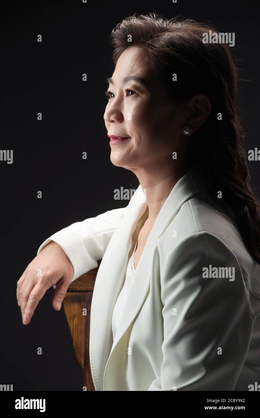 Side by side sitting looking away authority hi-res stock photography ...