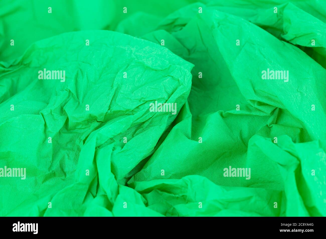 Crumpled green crepe paper texture as a background Stock Photo - Alamy