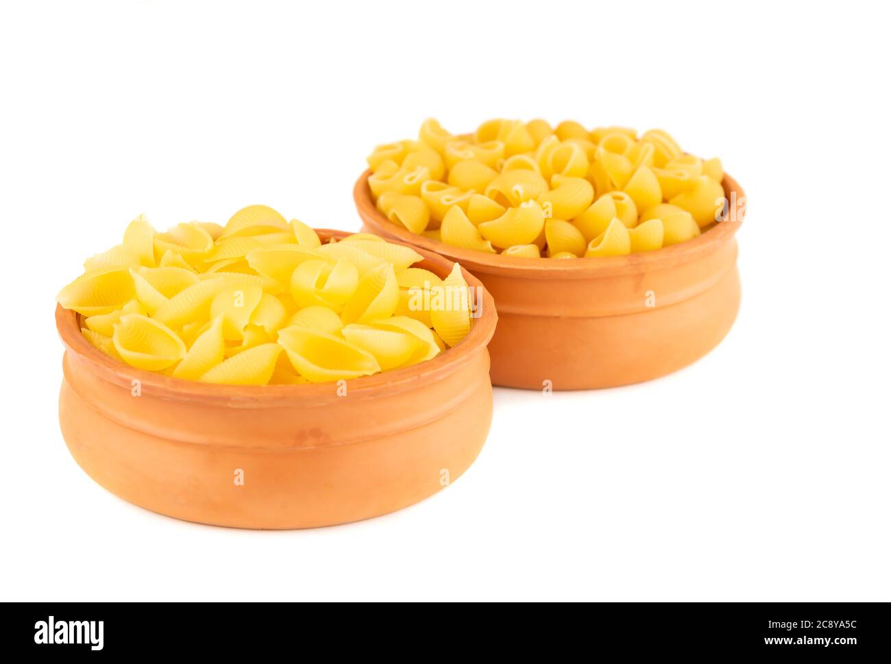 Various kind of Italian pasta in the clay bowls isolated on white ...