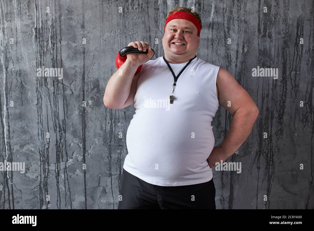 overweight sportive caucasian man shows his strength, muscles and ...