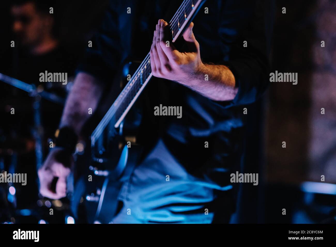 Shallow focus shot of the guitarist at the concert Stock Photo - Alamy
