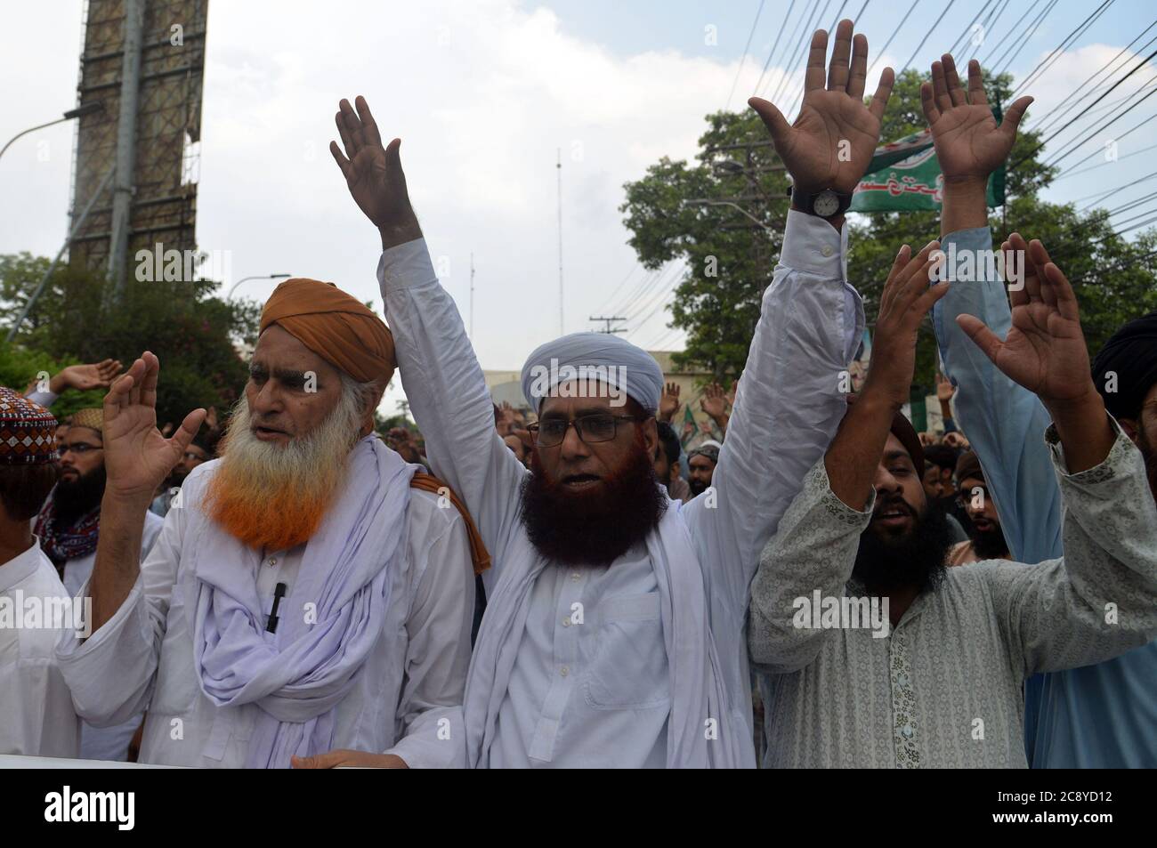 Pakistani activists of Sunni Tehreek (a religious group) are holding ...