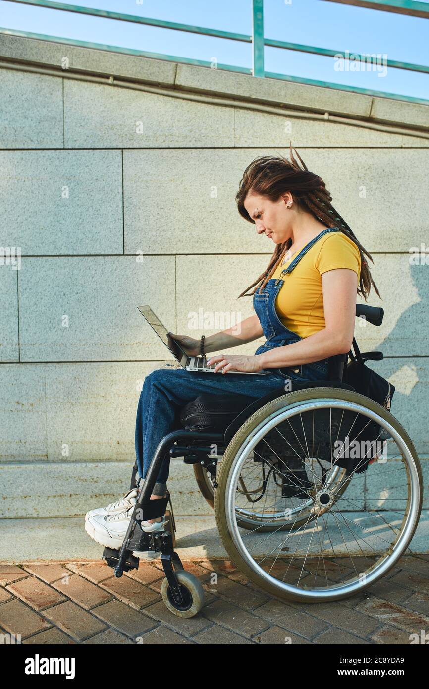 cute girl fixing her computer, dowload music, files, documents, video ...