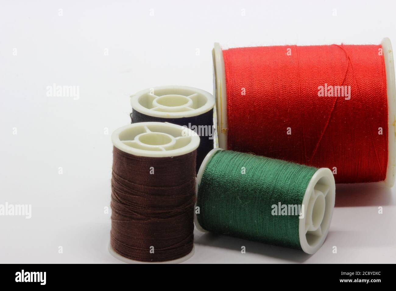 Green sewing thread spools hi-res stock photography and images - Alamy