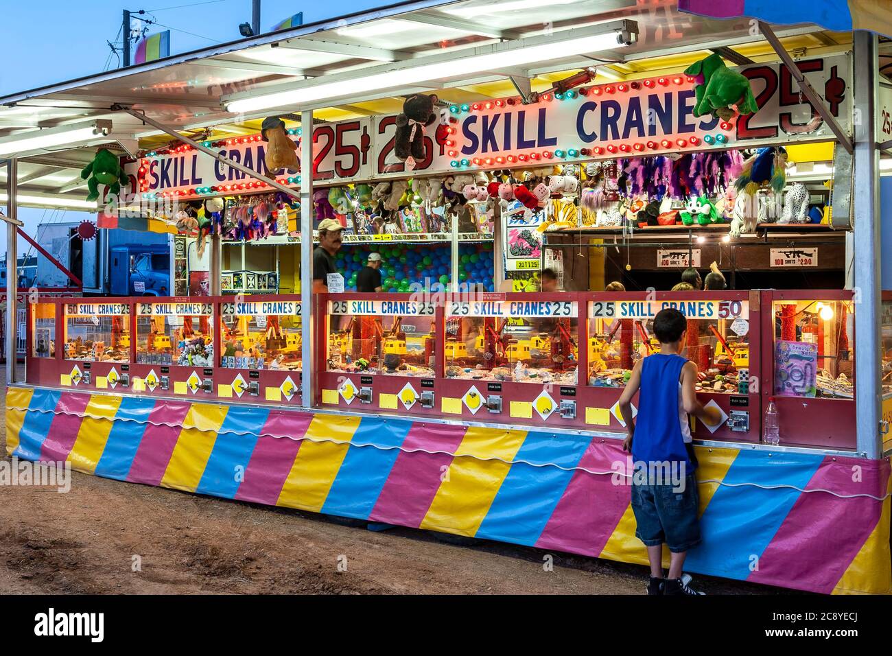 Boy at "Skill Cranes" concession, Rodeo de Santa Fe, New Mexico USA ...