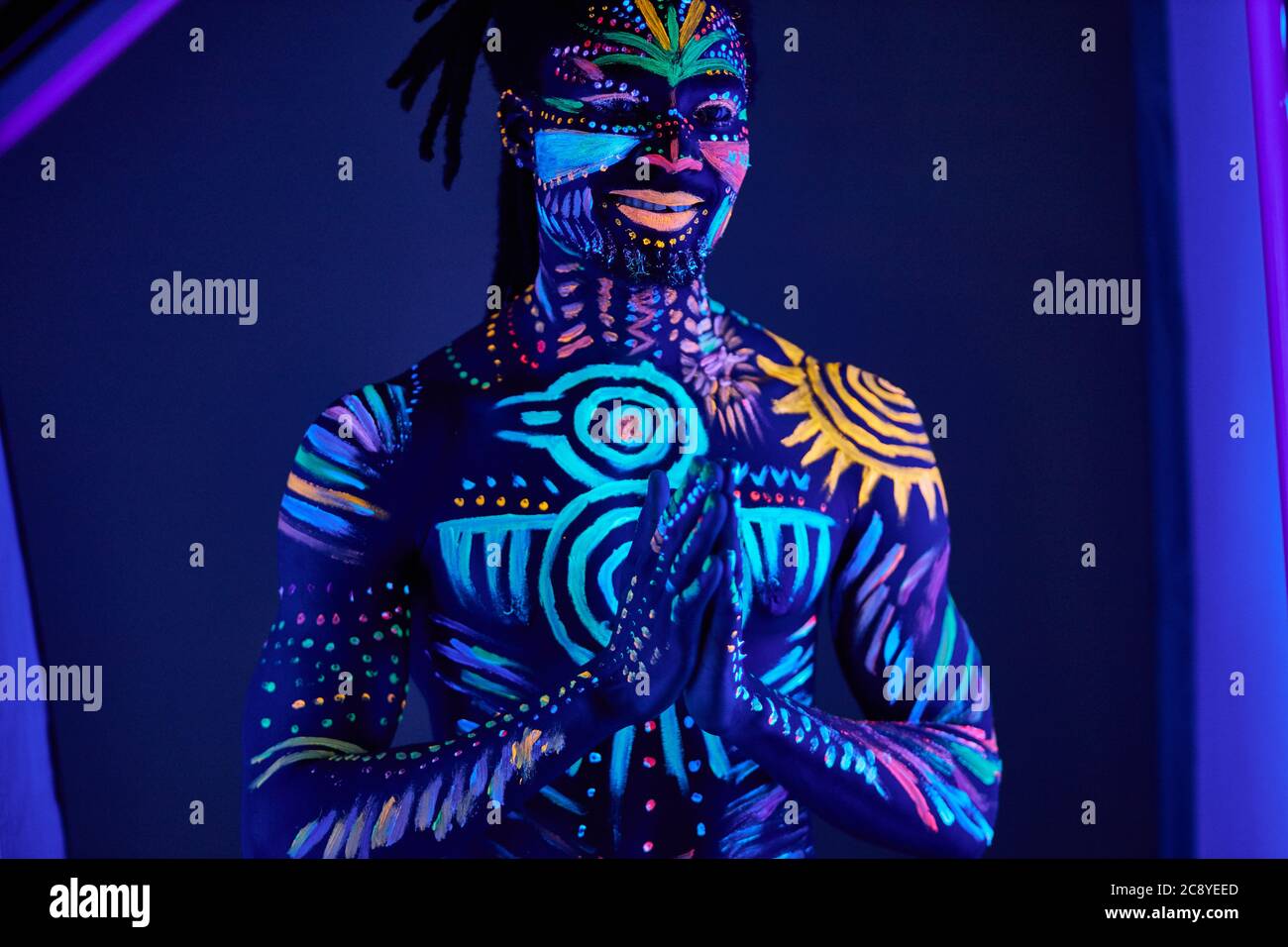 handsome young african guy with fluorescent prints on chest and other ...