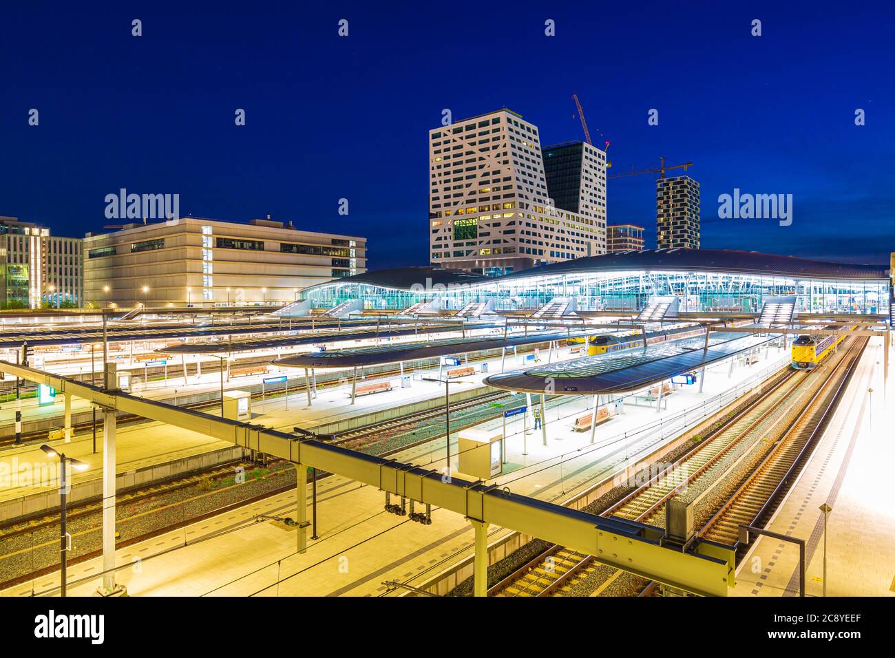 Utrecht central railway station at dusk. Modern contemporary ...