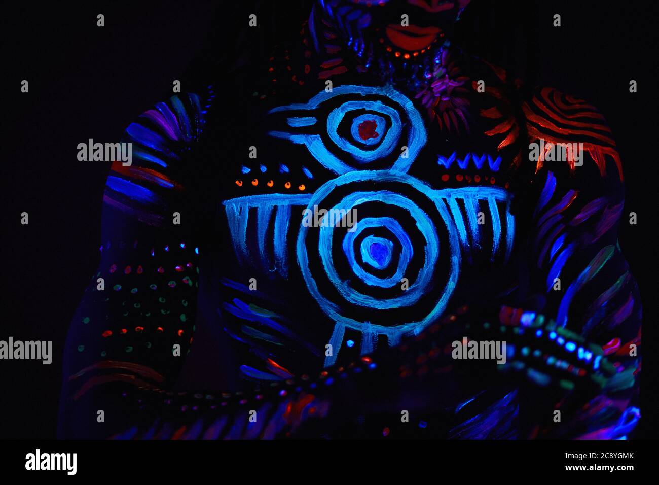 handsome young african guy with fluorescent prints on chest and other ...