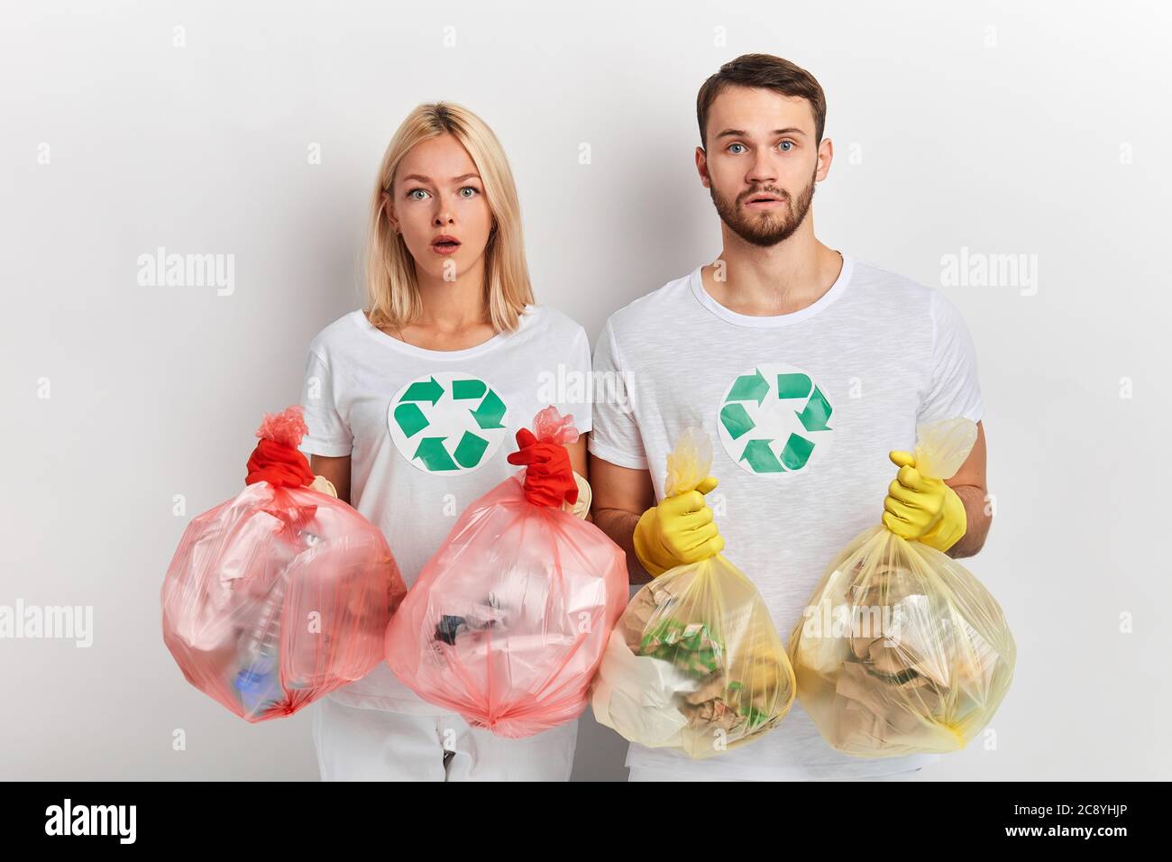 puzzled serious young people being shocked with environmental problems ...