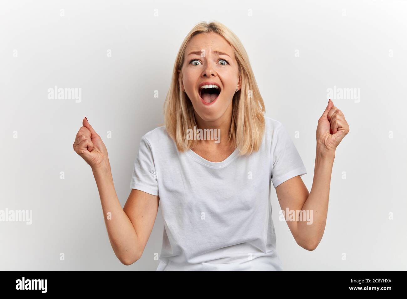 crazy funny girl rejoicing at her victory, close up portrait, studio ...