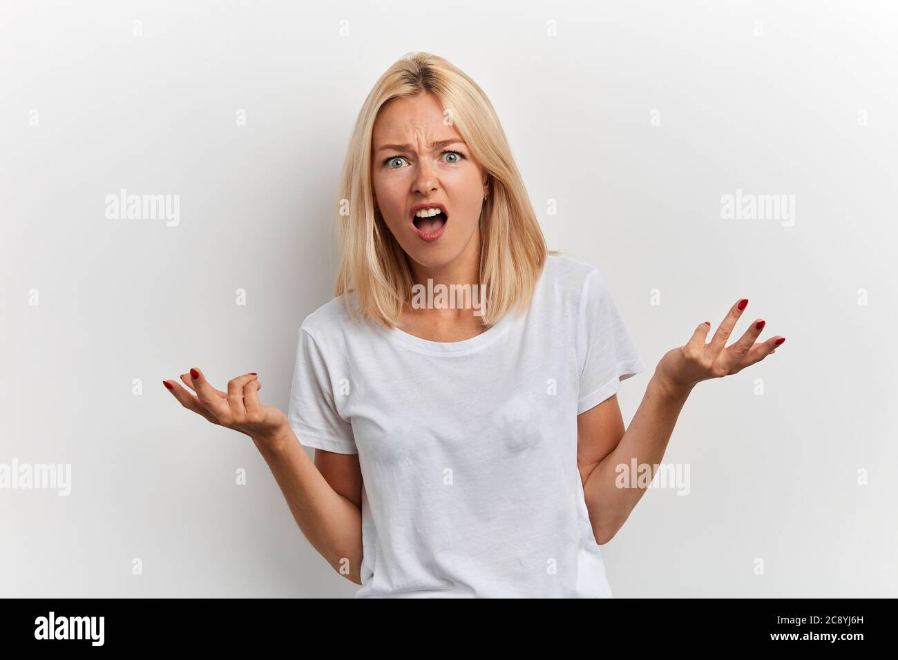 agressive girl having argument with a friend, close up portrait ...