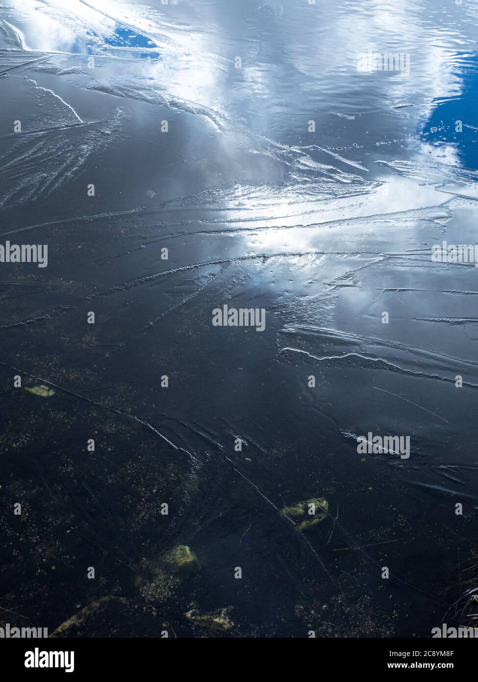 Icy reflection of the sky with texture Stock Photo - Alamy