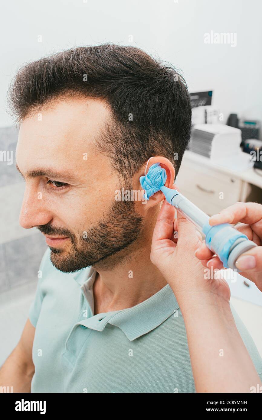 process of molded individual hearing aid earmolds. A man, having ...