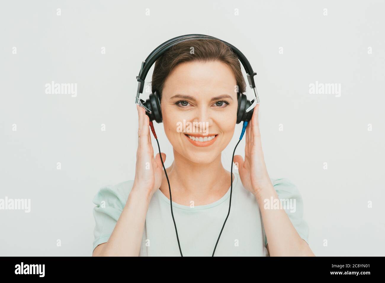 Hearing test, hearing diagnostic. A woman wearing headphones having an ...