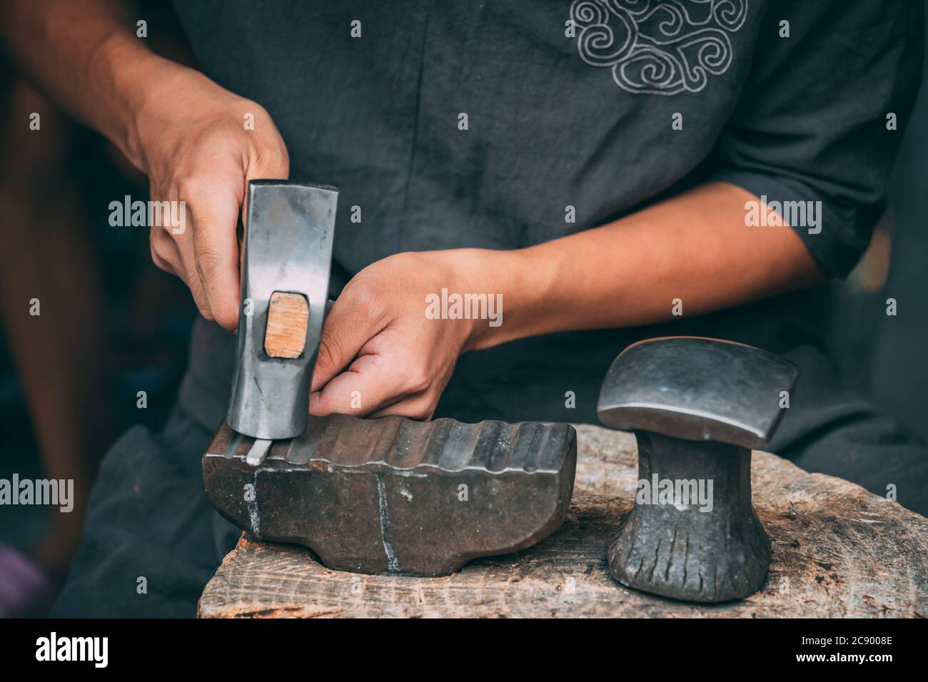 Man using hammer to make crafts on the street market in the Muslim ...