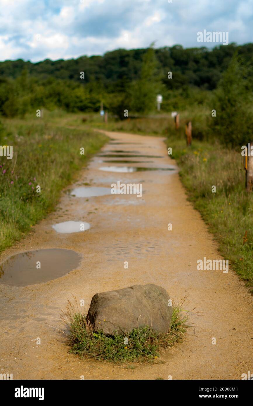 A rock blocking the path with a breathtaking landscape. A nature ...