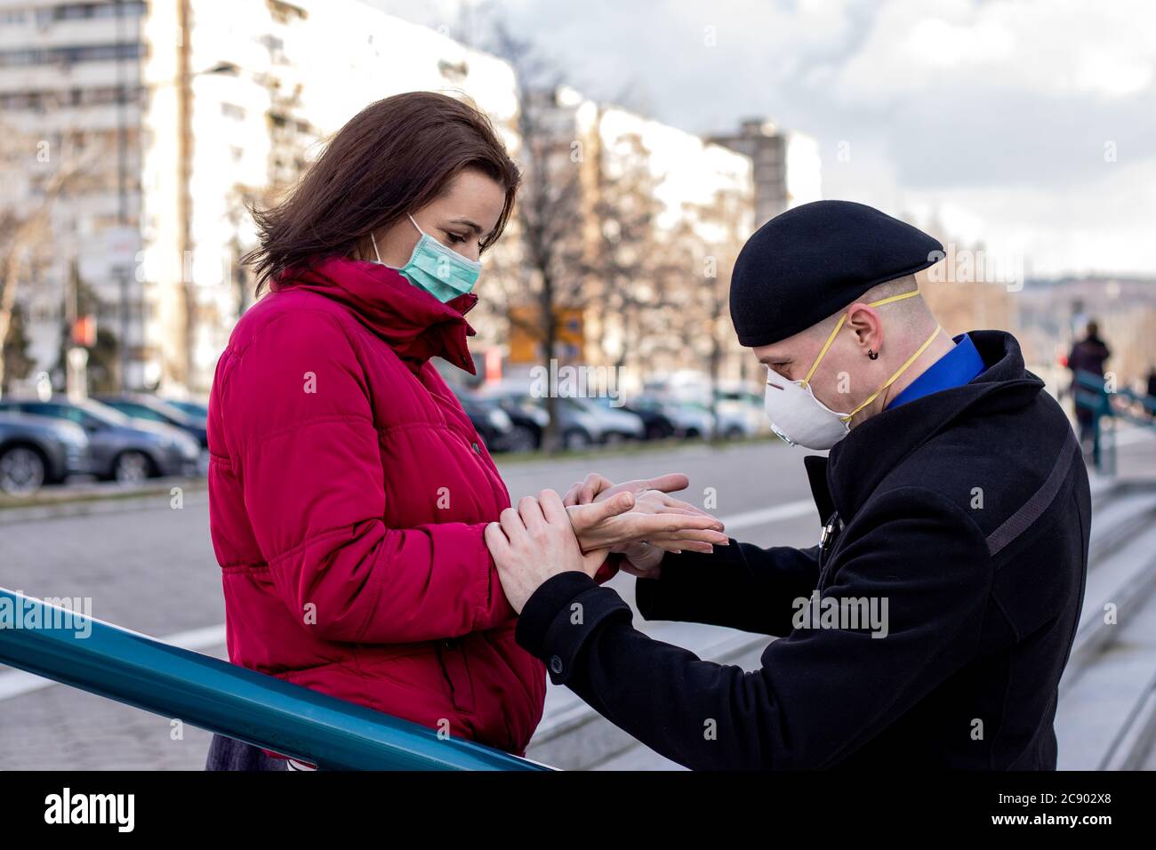 Young couple wearing two types of protective masks for protection from ...