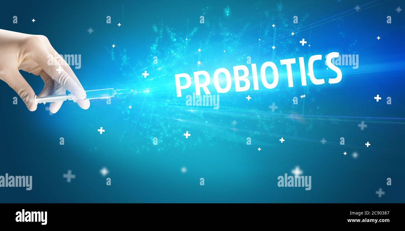Syringe, medical injection in hand with PROBIOTICS inscription, medical ...