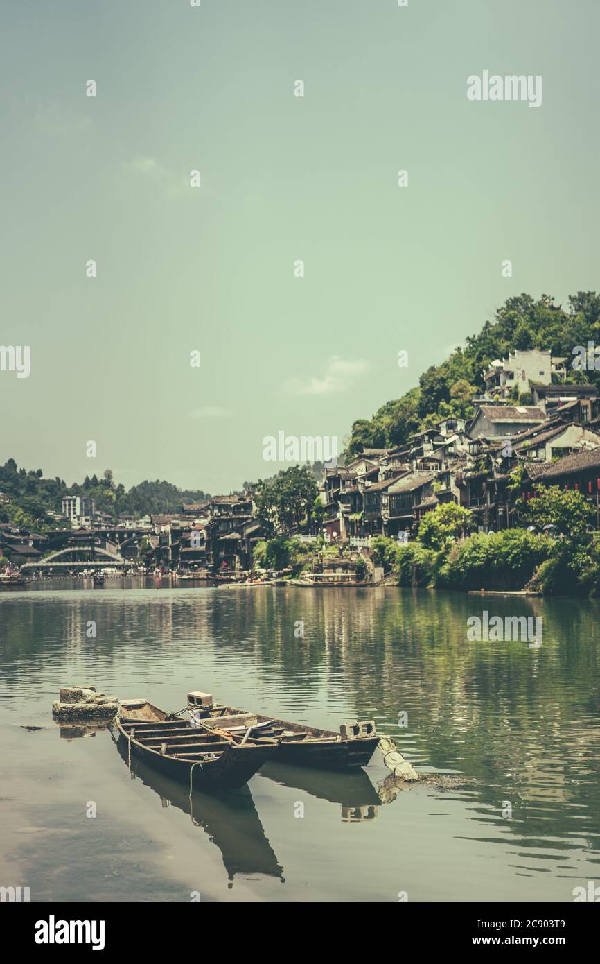 Old historic wooden tourist boats on the Tuo river, flowing through the ...