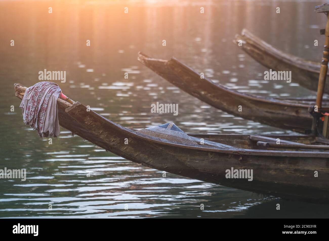 Old historic wooden tourist boats on the riverbanks of Tuo river ...