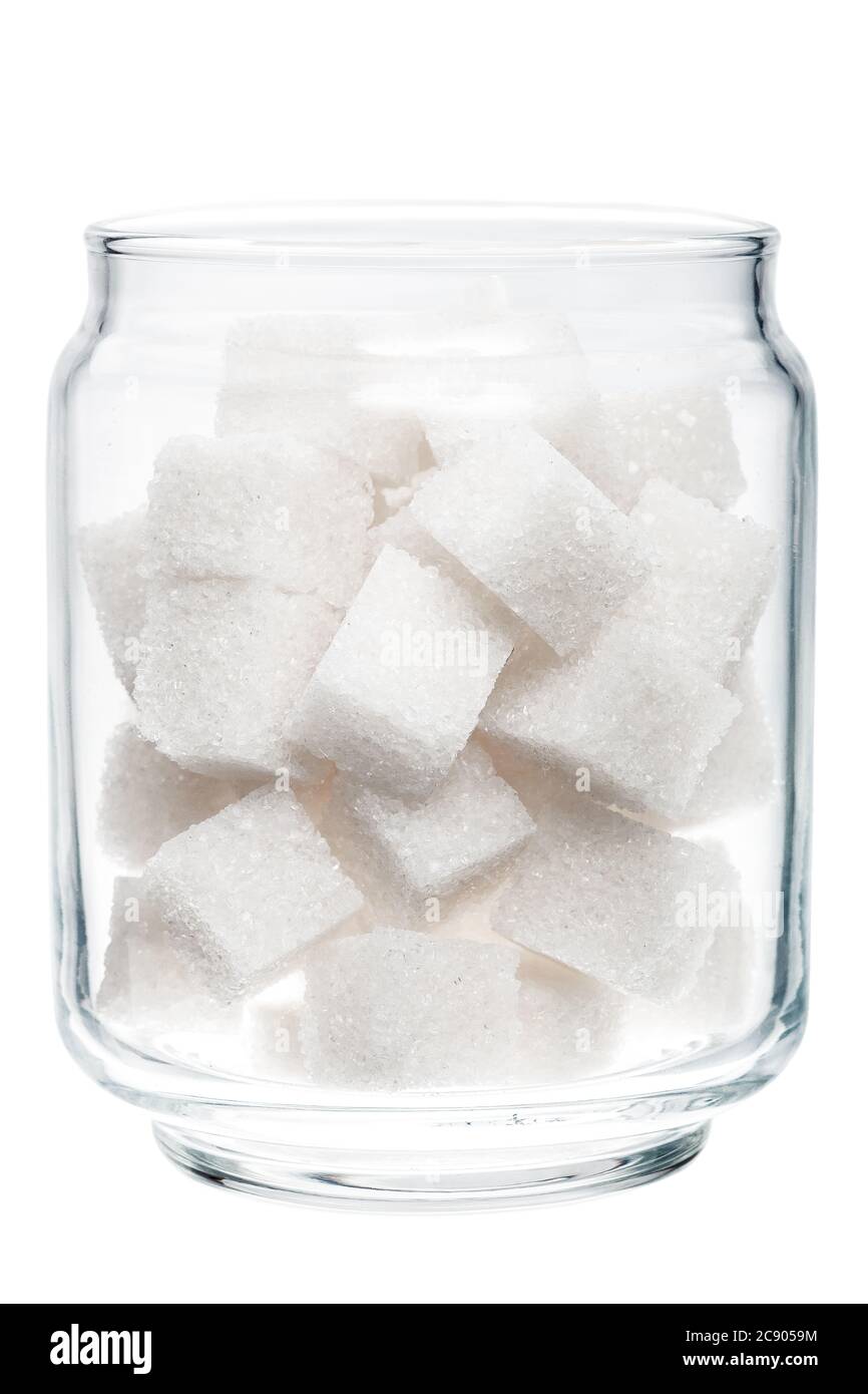 White lump sugar in a glass jar on a white background, sweet sugar in ...