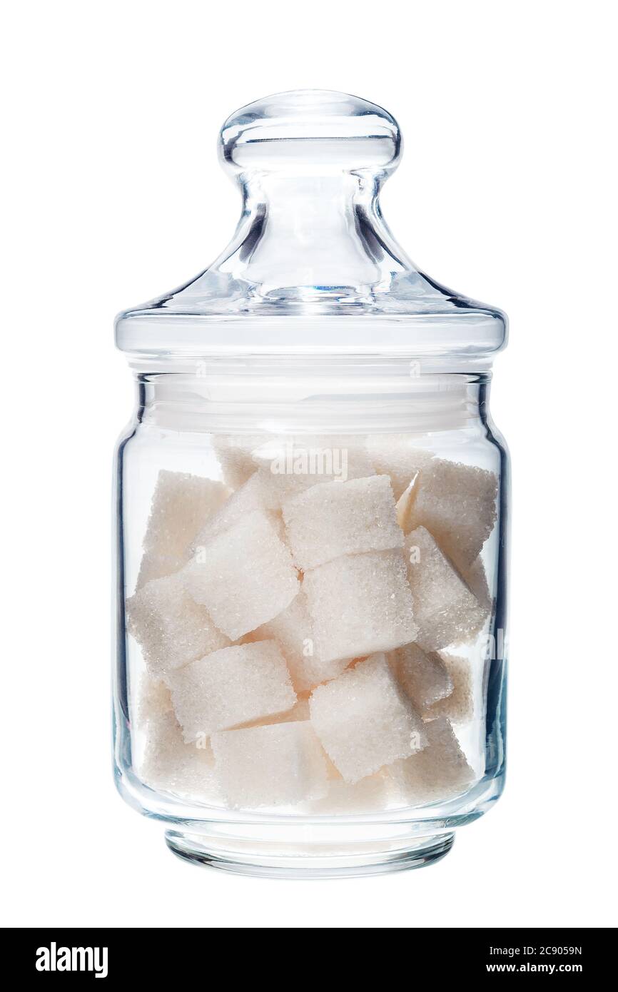 White lump sugar in a glass jar on a white background, sweet sugar in ...