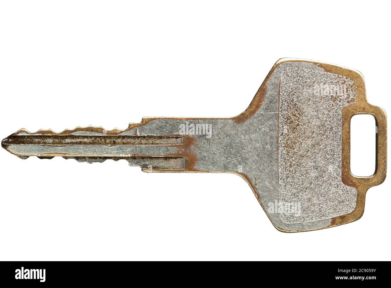 Key on a white background with reflection, the used old key in ...