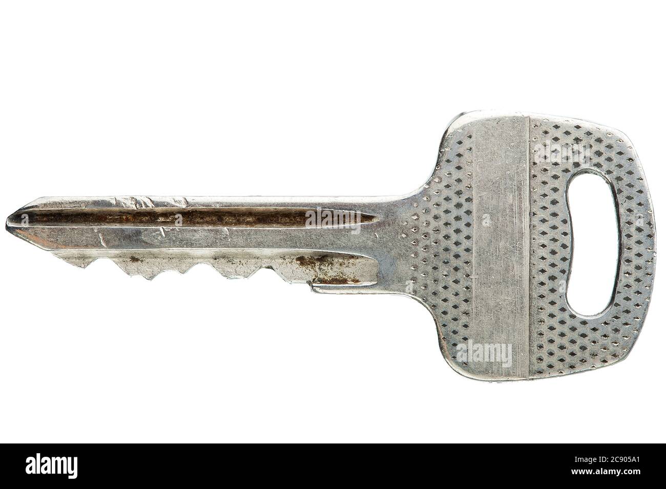 Key on a white background with reflection, the used old key in ...