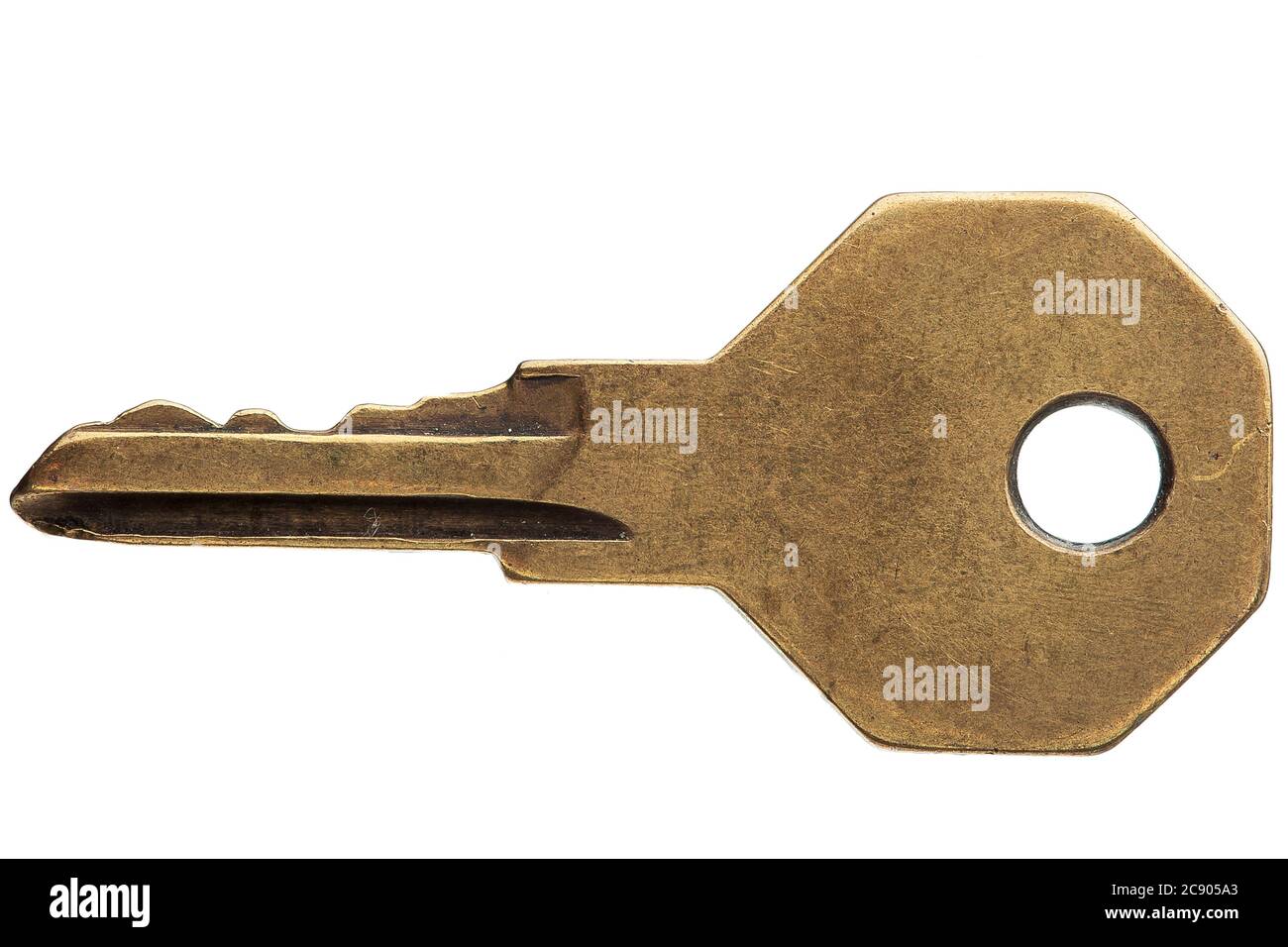 Key on a white background with reflection, the used old key in ...