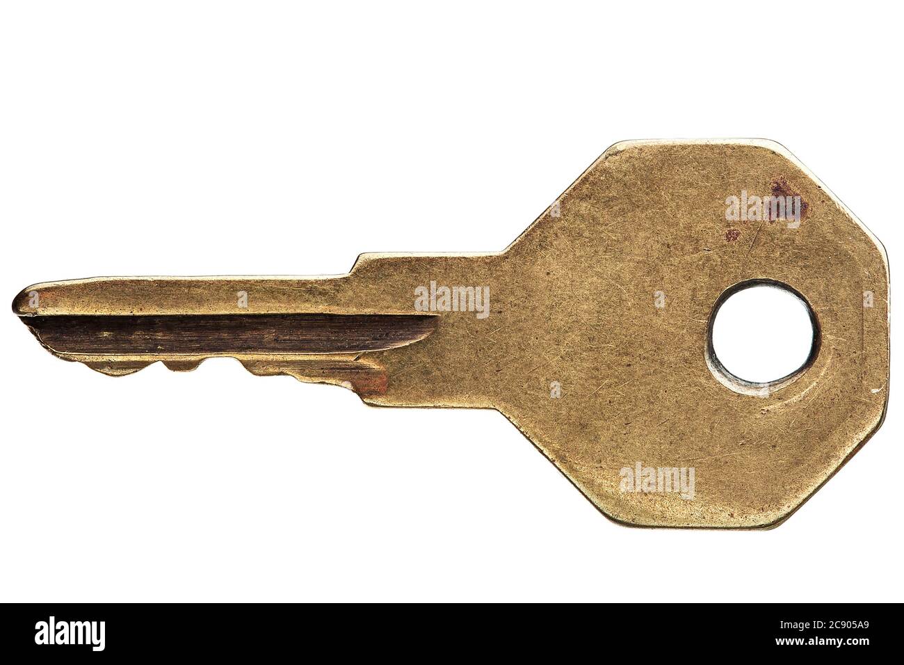 Key on a white background with reflection, the used old key in ...